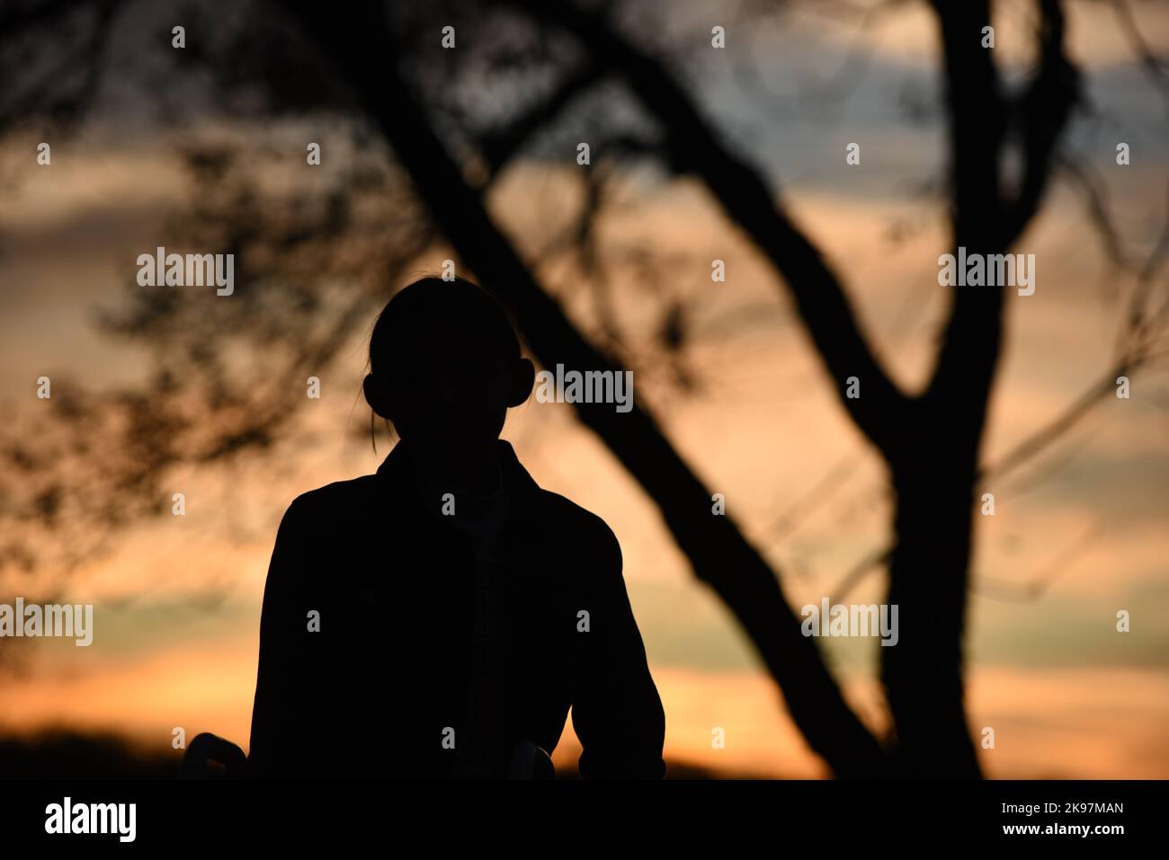 silhouette of person with sunset behind Stock Photo - Alamy