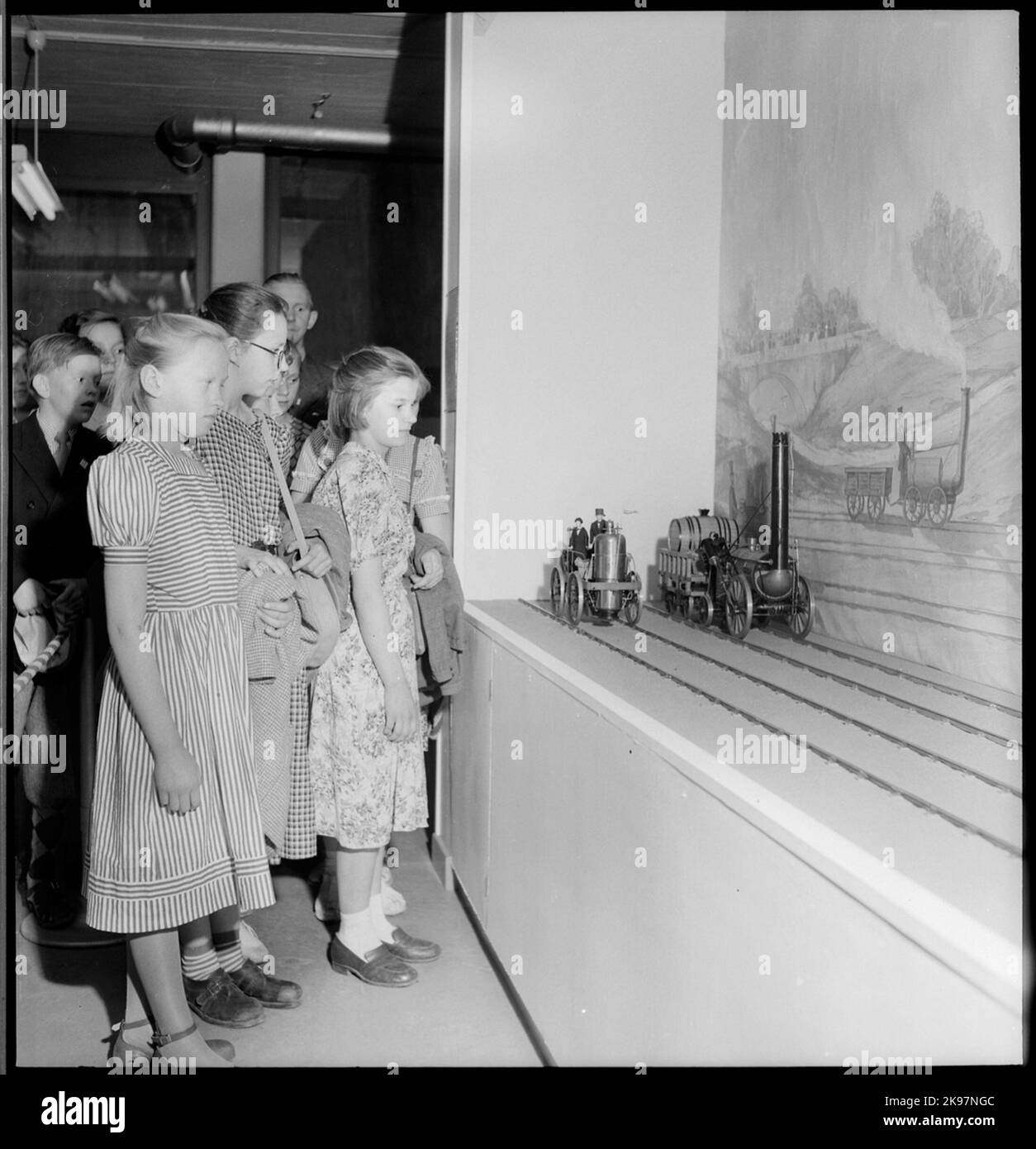 Students consider model rails of the Rainhill competition Stock Photo ...