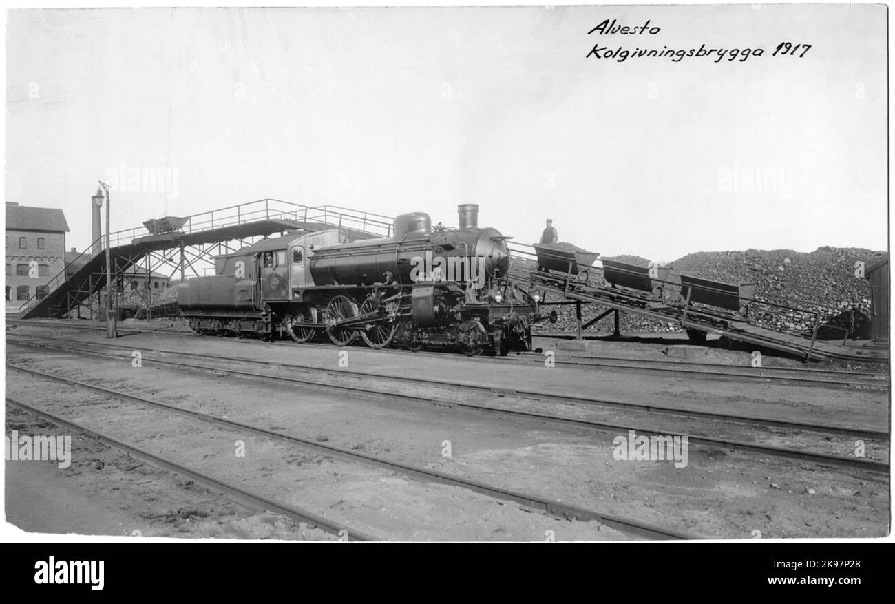 Loading carbon at the yard at Alvesta station. The steam locomotive is ...