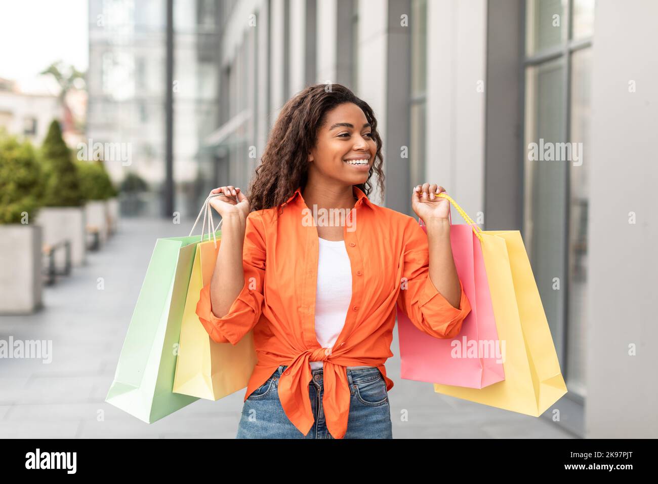 Glad pretty millennial african american female customer in casual with ...