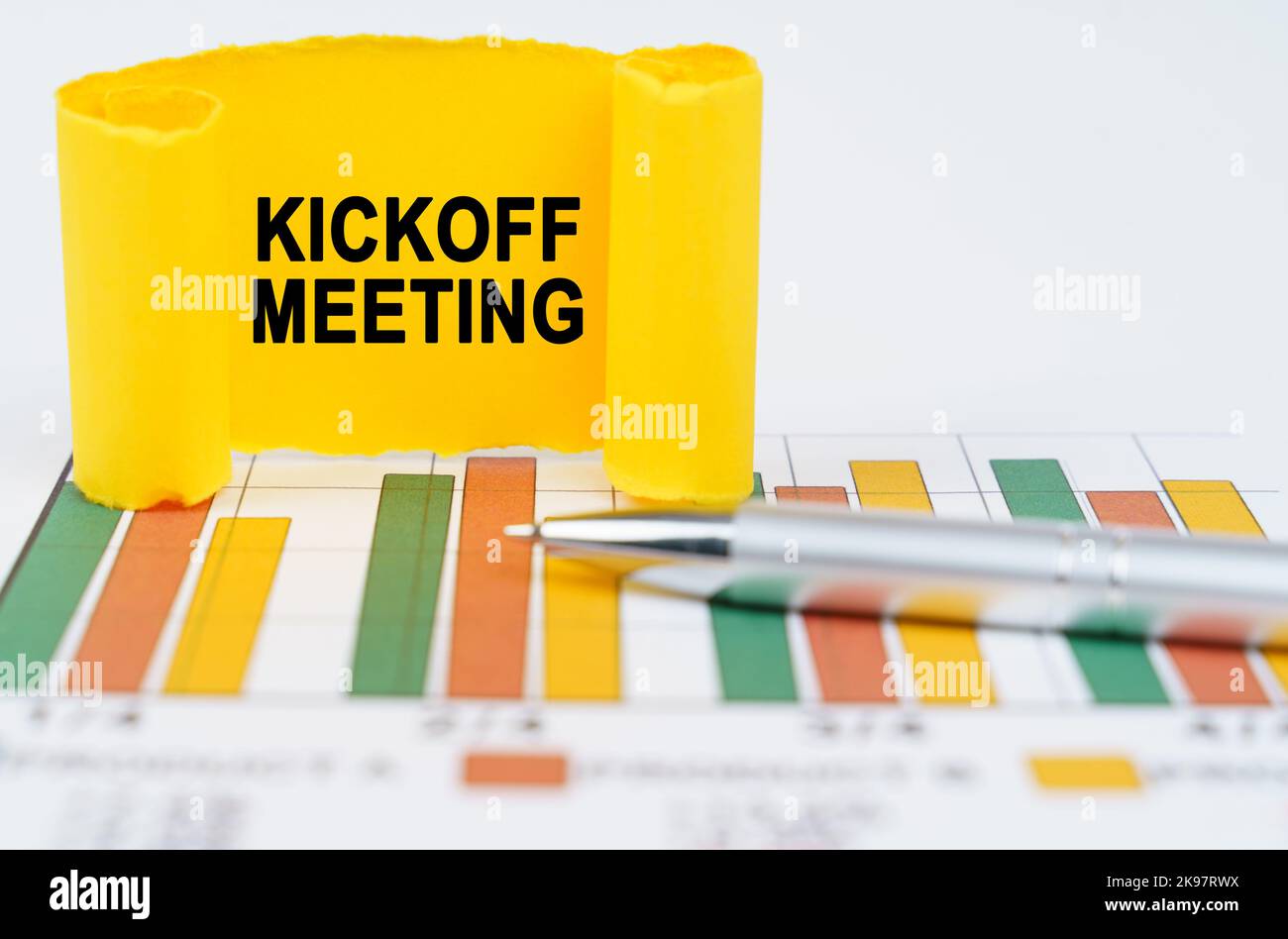 Business concept. On the business charts are a pen and a paper plate ...