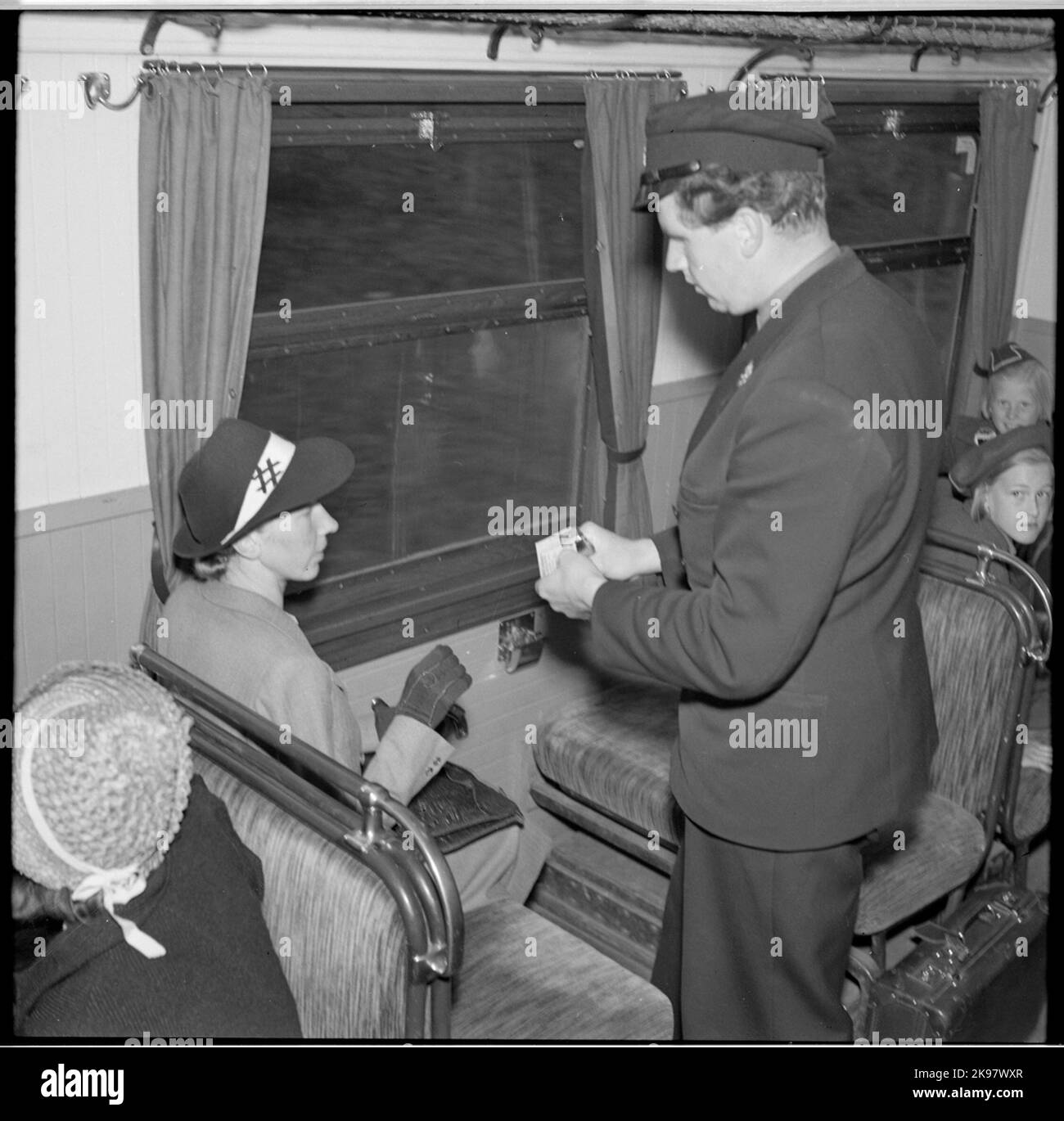 Ticket control of conductor Stock Photo - Alamy