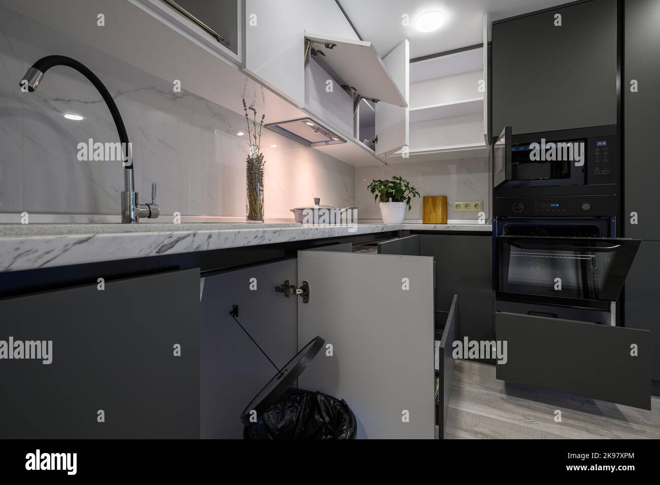 Modern simple trendy dark grey and white kitchen Stock Photo - Alamy