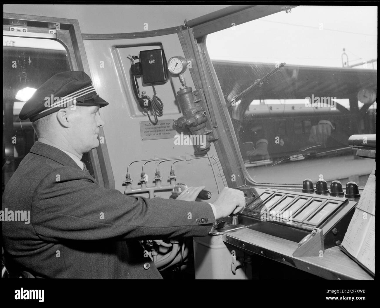 Locomotive driver aboard an electric motor car Stock Photo - Alamy