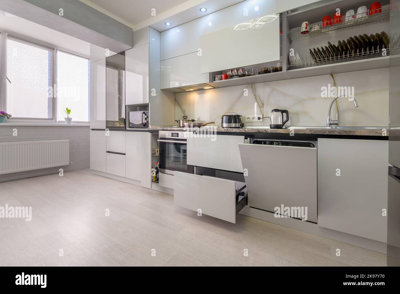 Interior of modern trendy white kitchen Stock Photo - Alamy