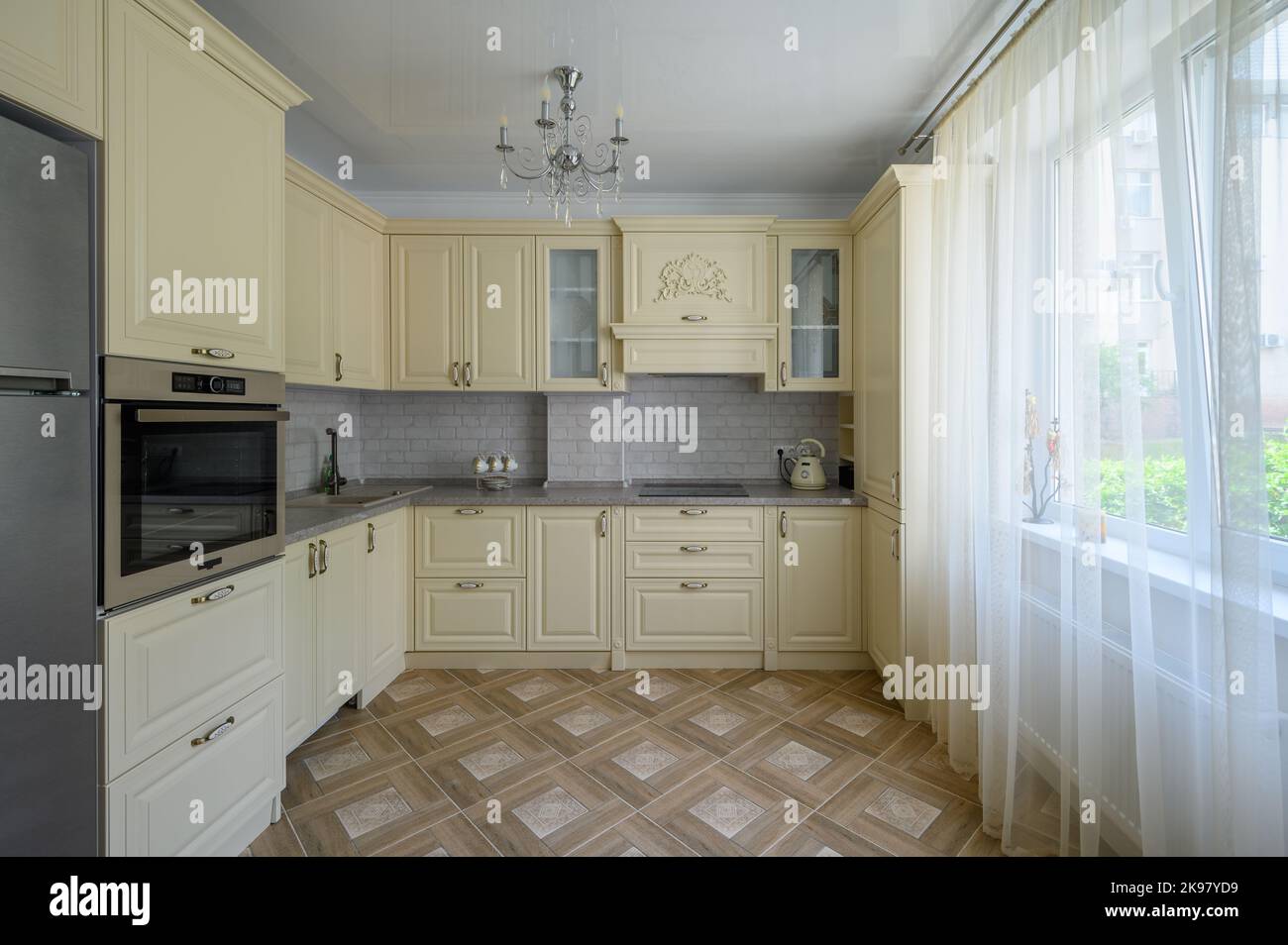 Interior of modern trendy cream colored kitchen Stock Photo - Alamy