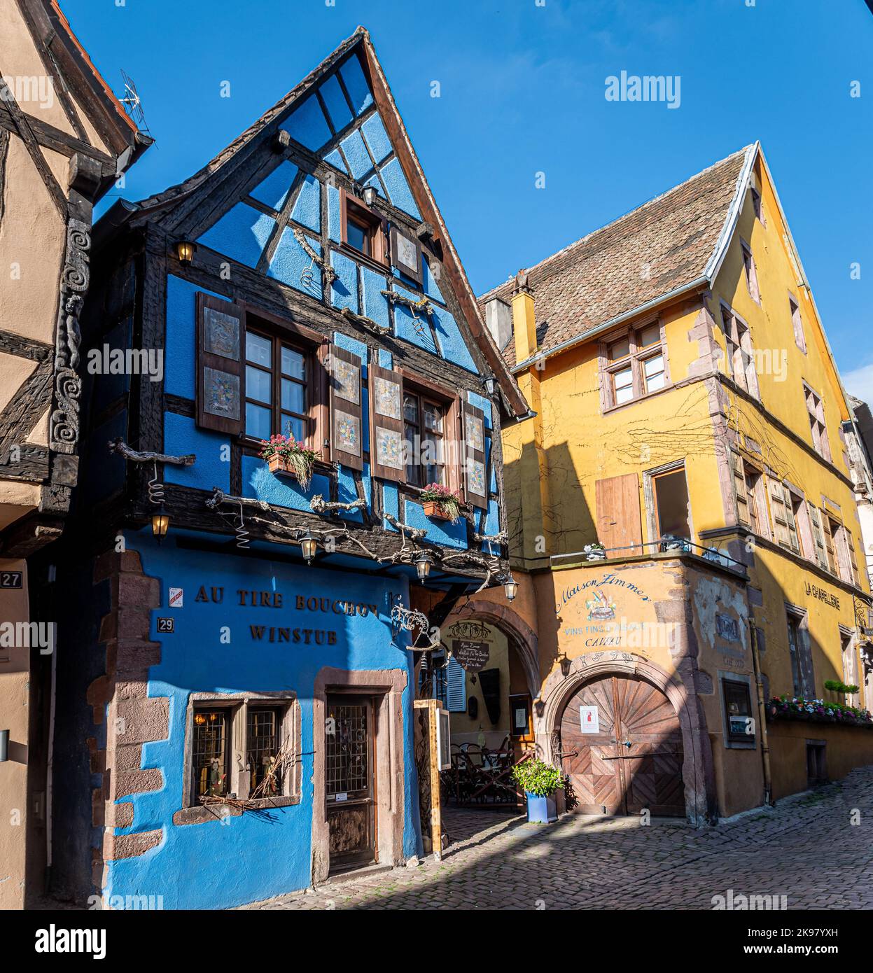 Traditional old alsatian houses in Riquewihr in Alsace in the ...