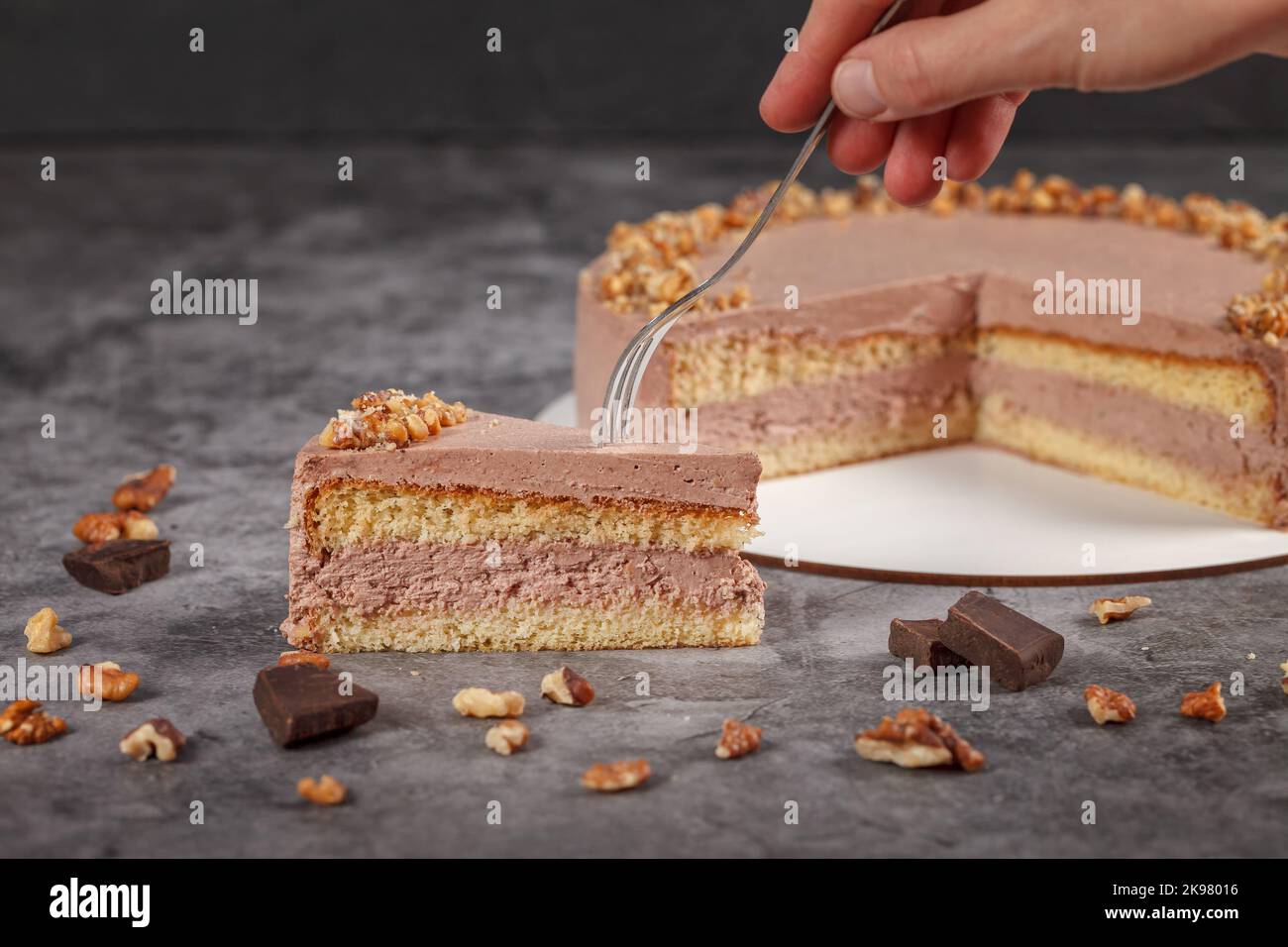 Chocolate cake nut. Homemade, creamy cake with nuts and cream, on a ...