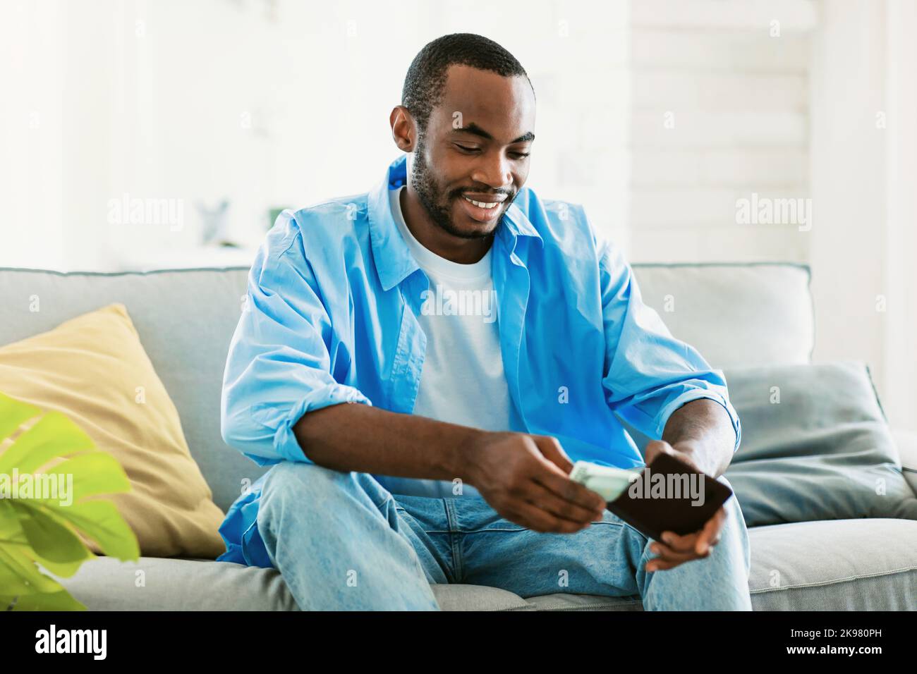 Money and couch hi-res stock photography and images - Alamy