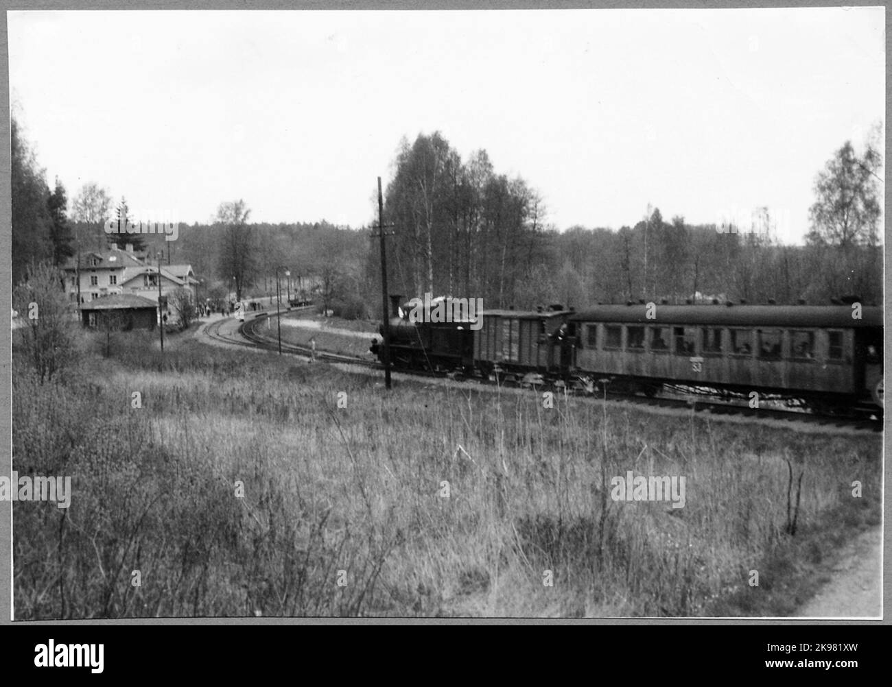 Passenger trains on entrance to Almvik station Stock Photo - Alamy