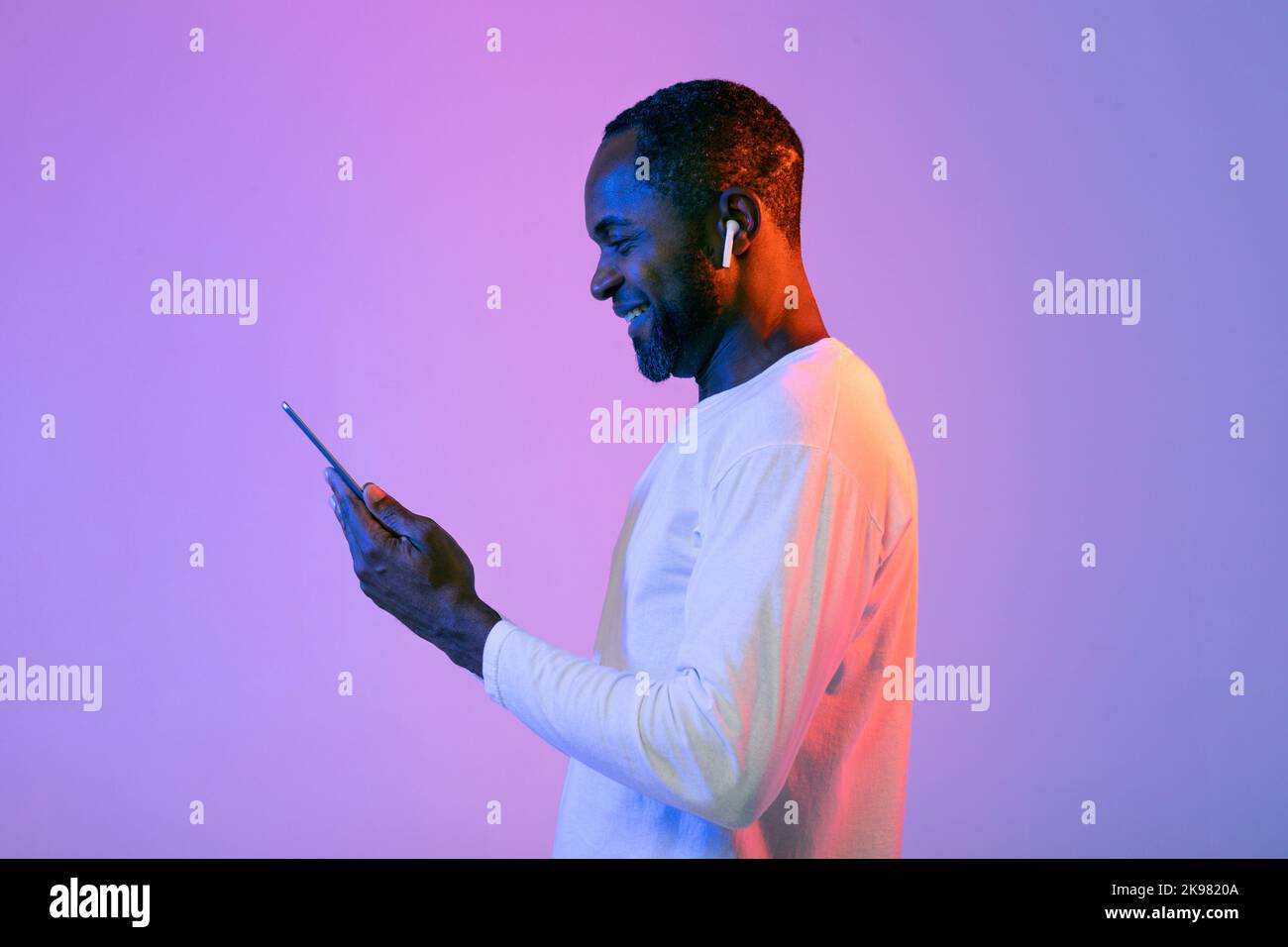 Happy mature man earbuds hi-res stock photography and images - Alamy