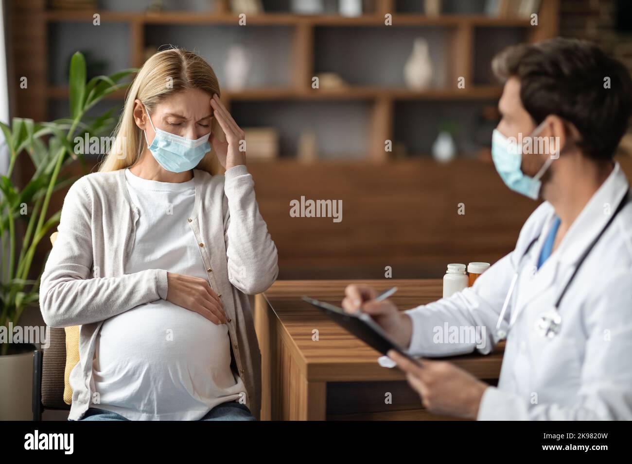 Sick Pregnant Woman Wearing Medical Mask Having Appointment With ...