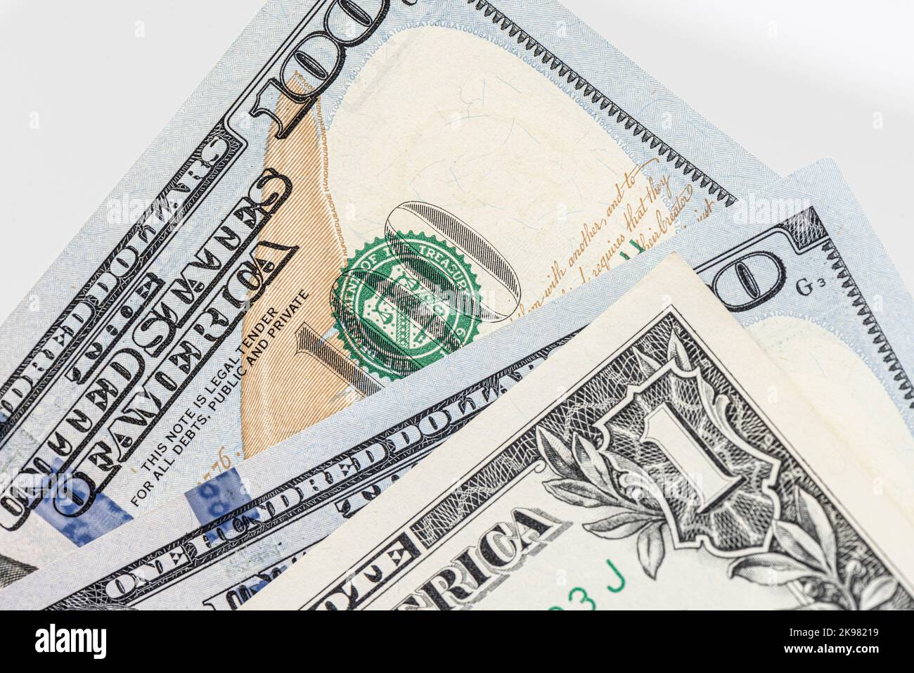 US dollar rolled up with a rubber band isolated on white. the most ...