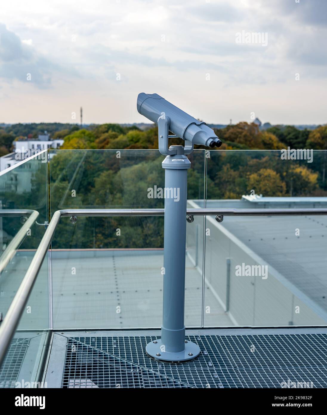 The binoculars are mounted on a solid, rotating column. Photo taken in ...