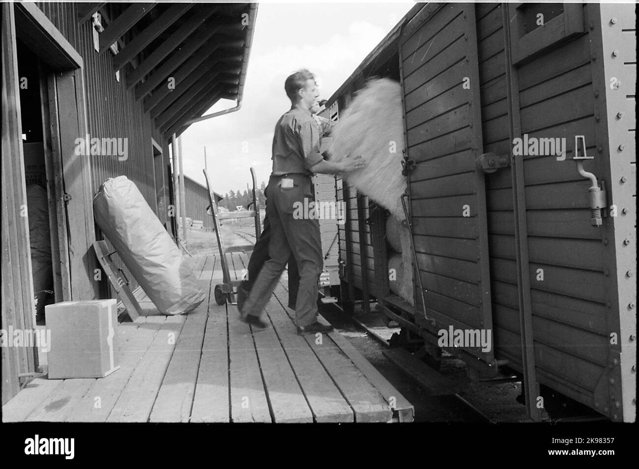 Loading of freight wagon Stock Photo - Alamy