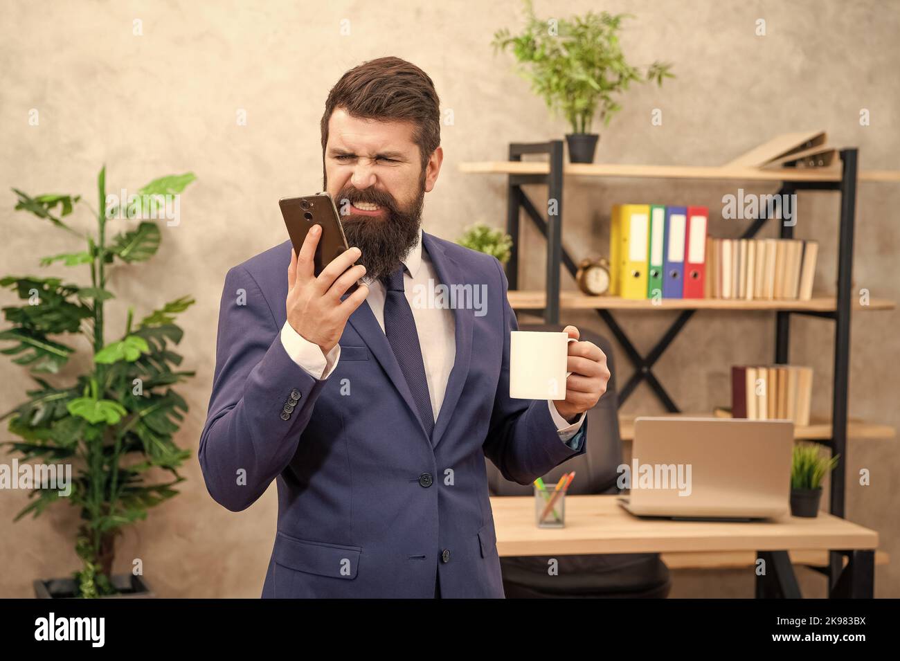 Stress at work. Angry man yelling at cellphone. Mobile communication ...