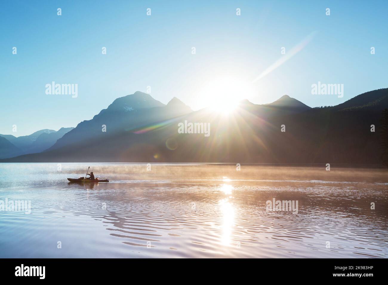 Beautiful Bowman lake with reflection of the spectacular mountains in ...