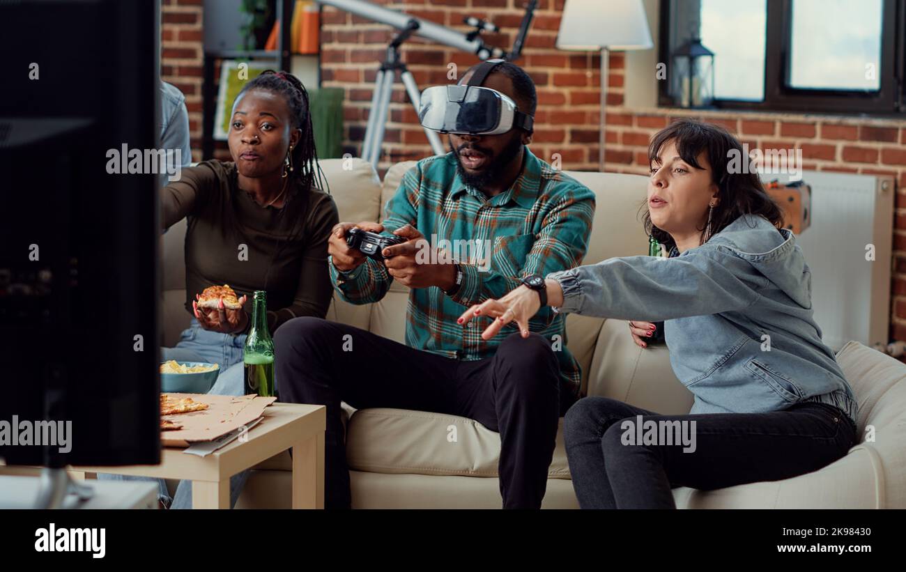 Multiethnic group of people losing video games with virtual reality ...
