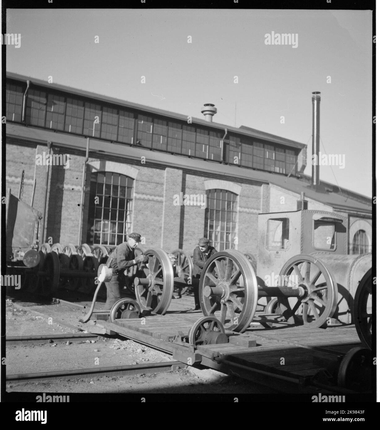 Loading of rail wheels and shoulders on a sliding table Stock Photo - Alamy