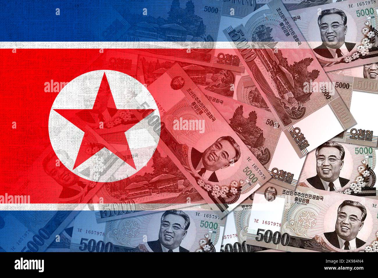 North Korean flag and North Korean Won cash banknotes (money, economy ...