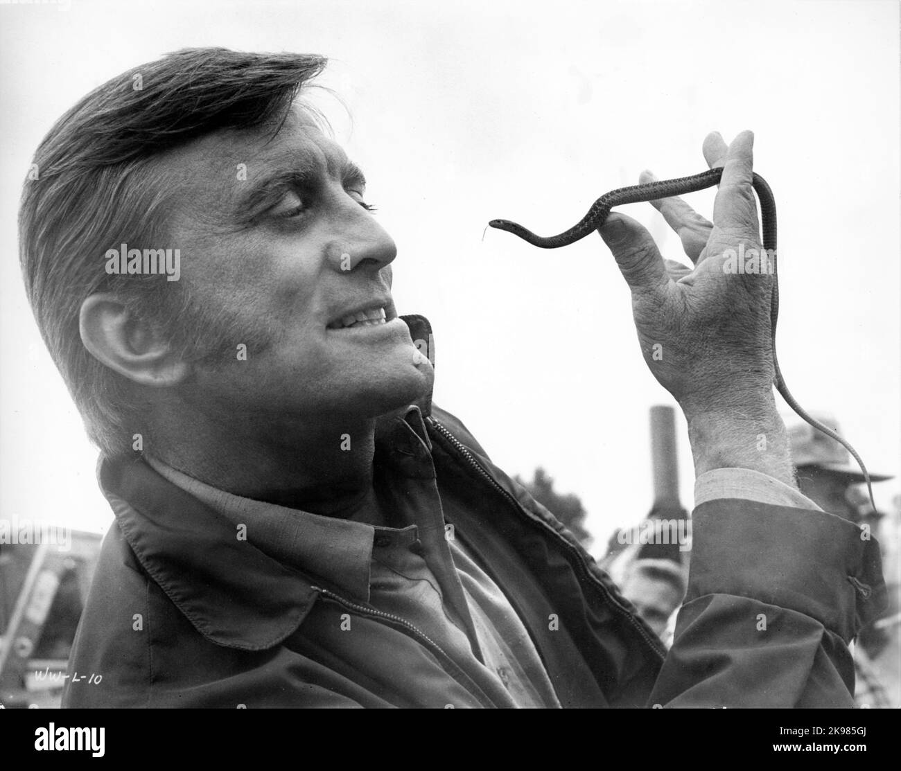 KIRK DOUGLAS on set location candid with snake during break in filming ...
