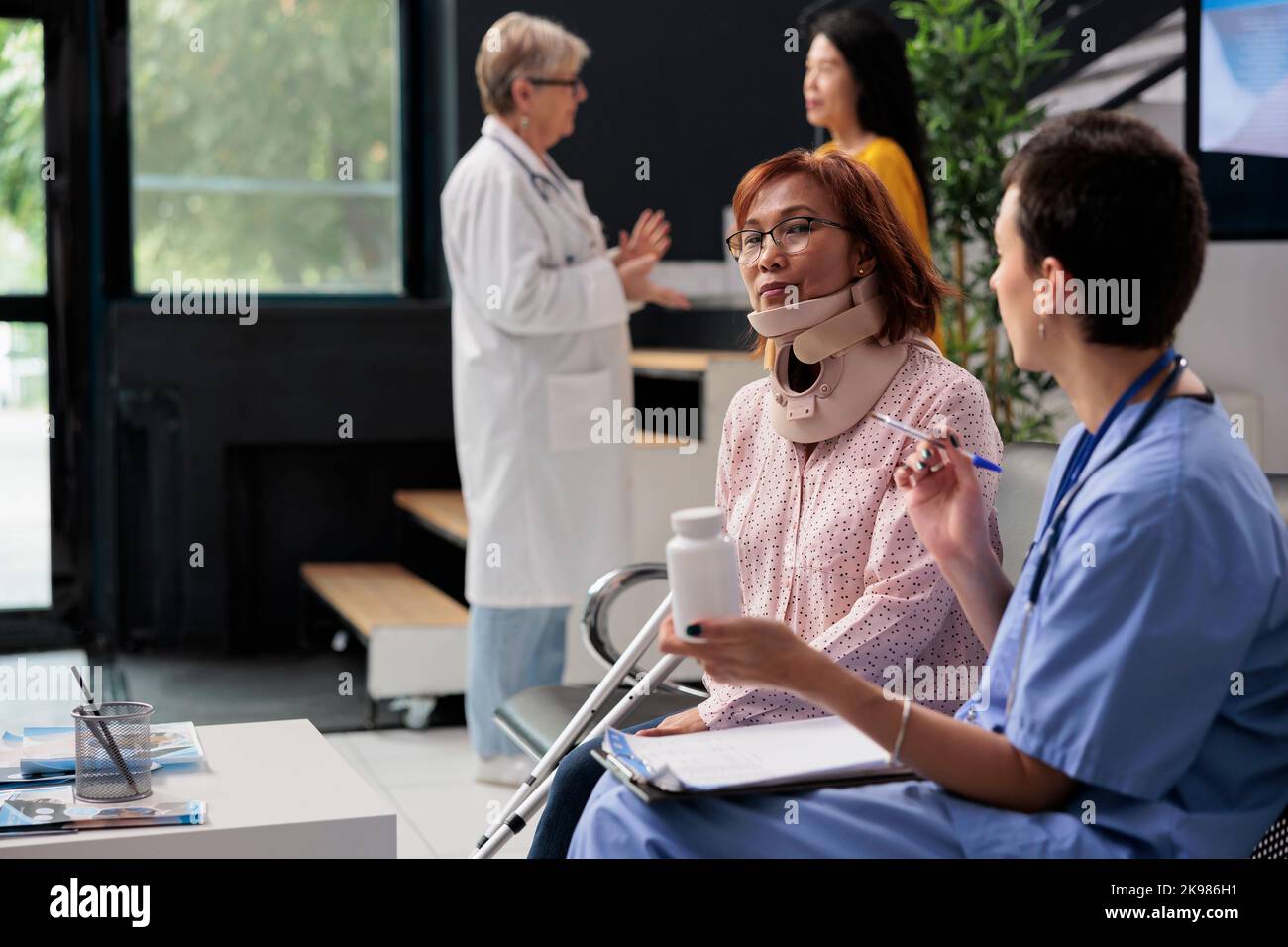 Health specialist holding pills bottle explaining recovery treatment to ... Health specialist holding pills bottle explaining recovery treatment to ...