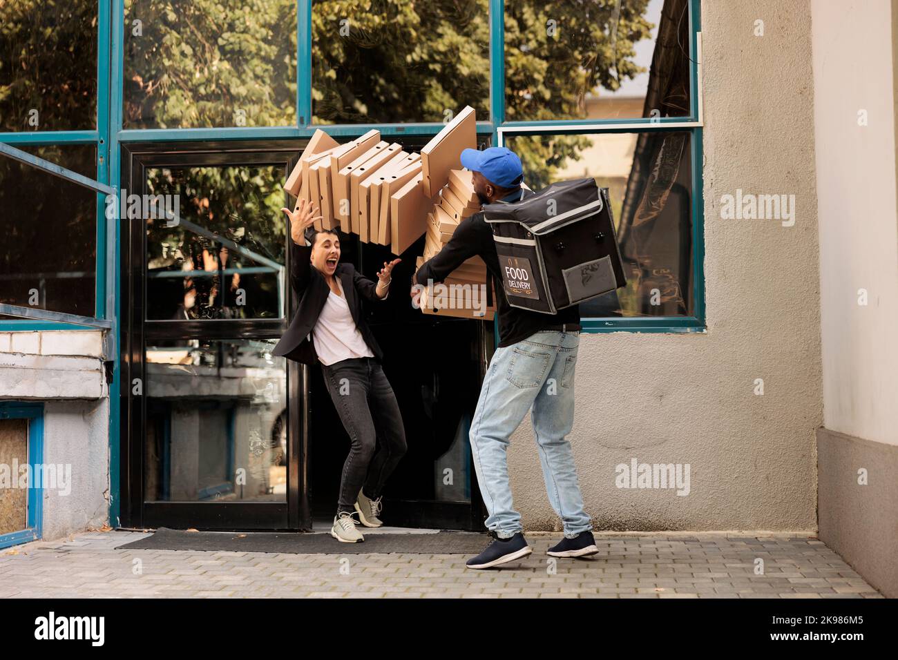 Shocked woman catching falling pizza boxes pile, clumsy pizzeria ...
