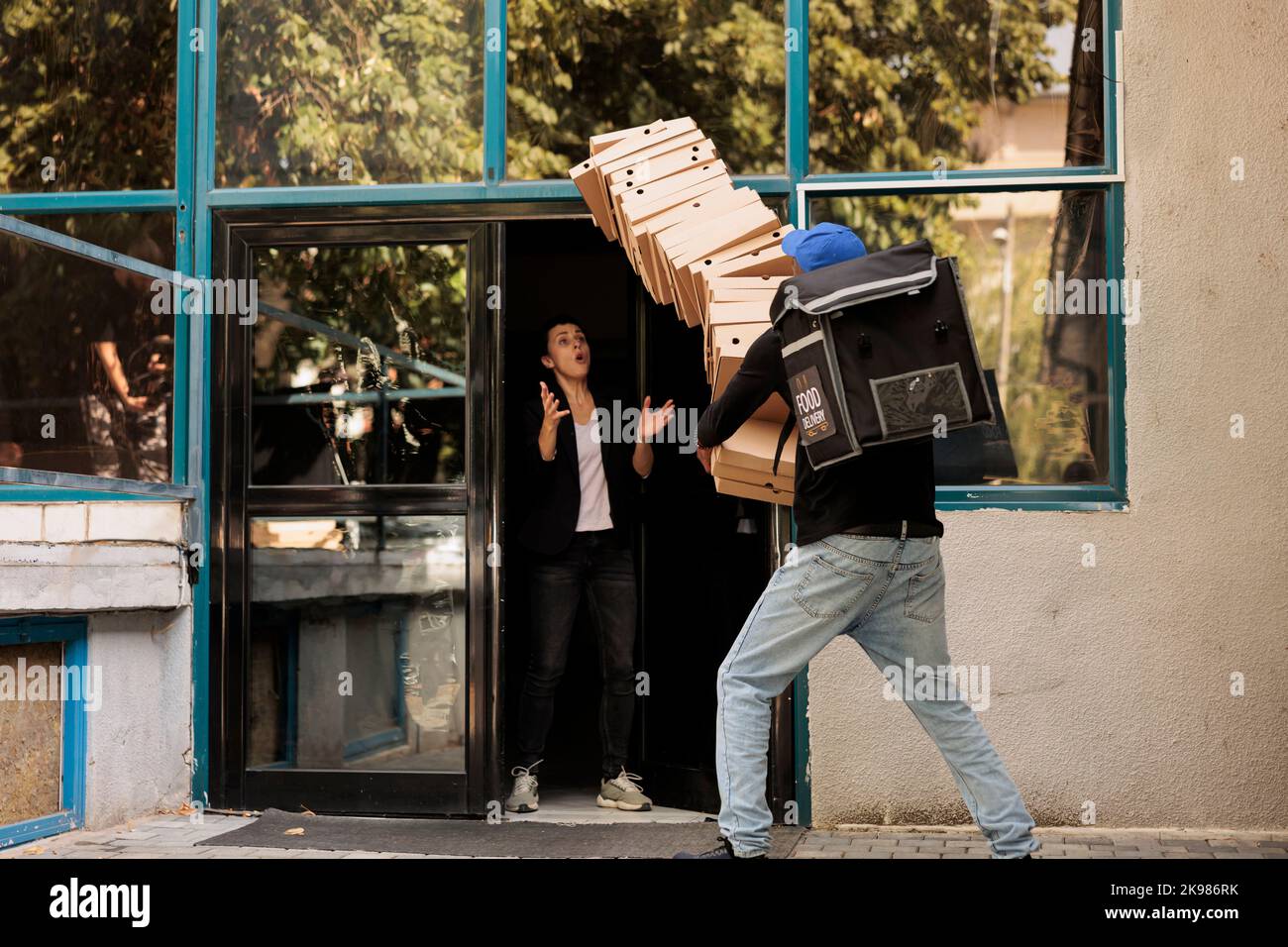 Delivery man falling stack boxes hi-res stock photography and images ...