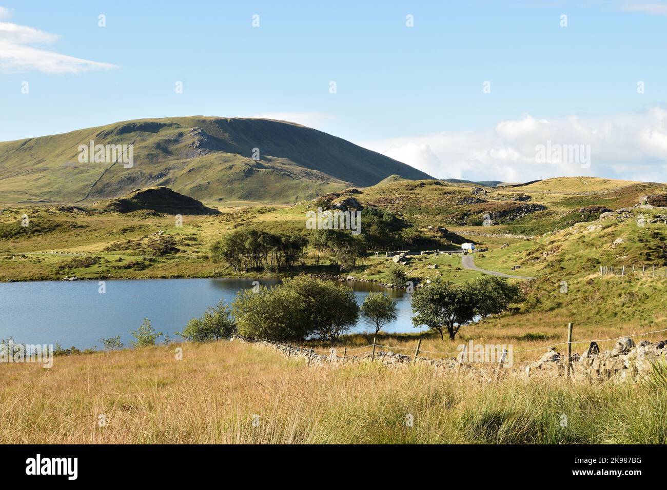 The larger of the Cregennan Lakes with a VW Combi van parked up in the ...
