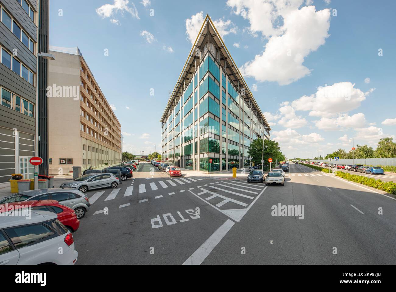Metal and glass office building facades at an urban crossroads Stock ...