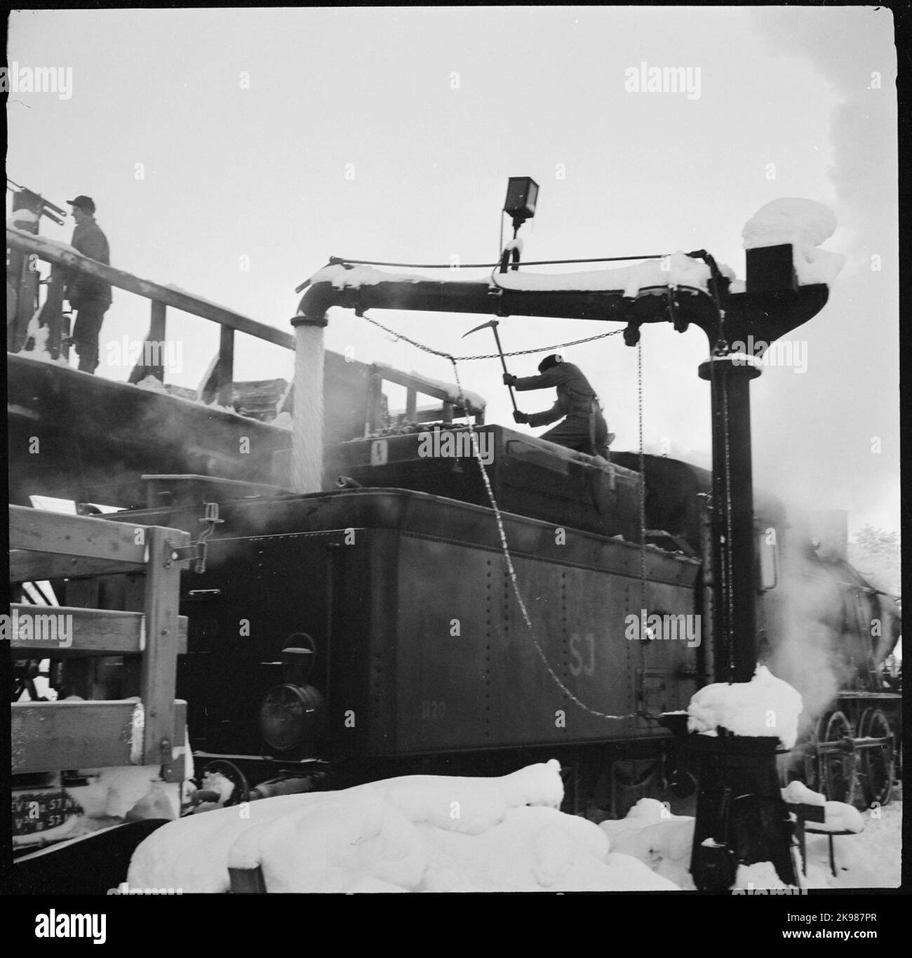 The State Railways, SJ E2 1120. Refilling coal that is watered Stock ...