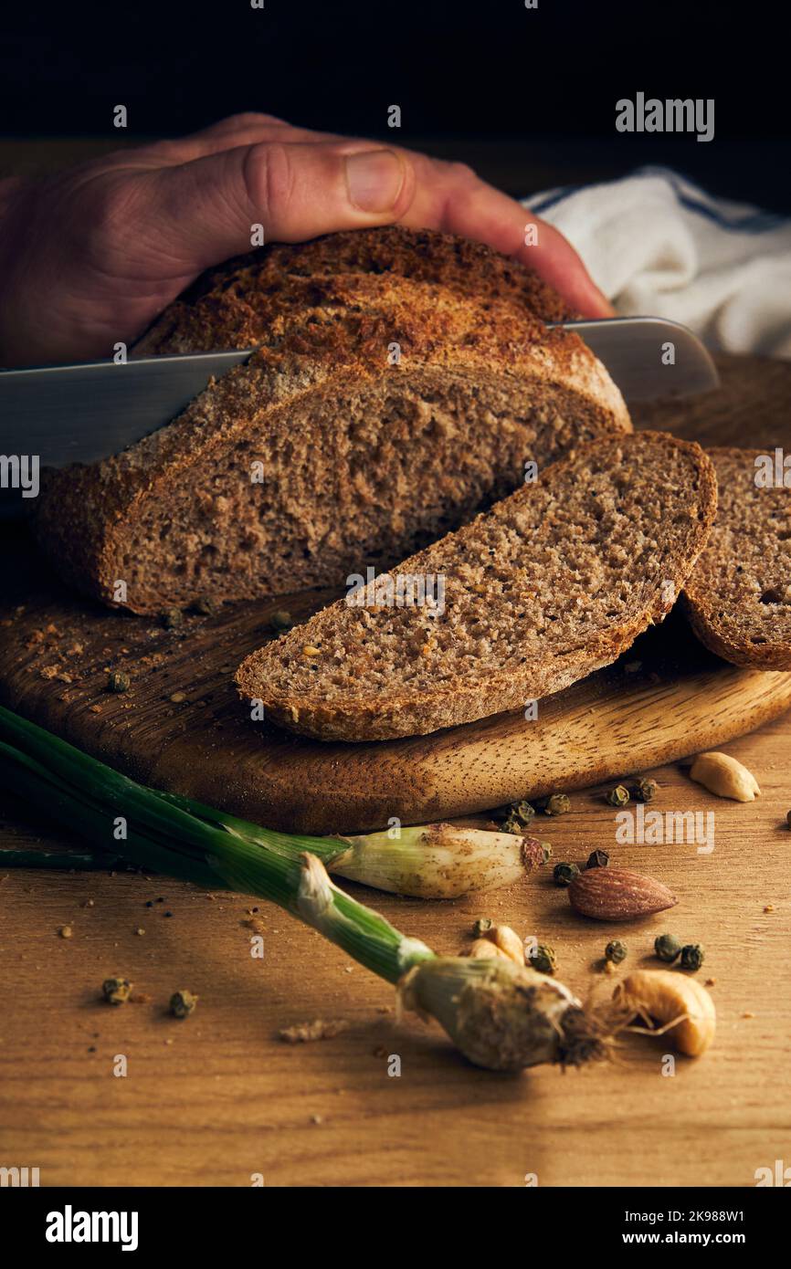Hand knife sliced bread hi-res stock photography and images - Alamy