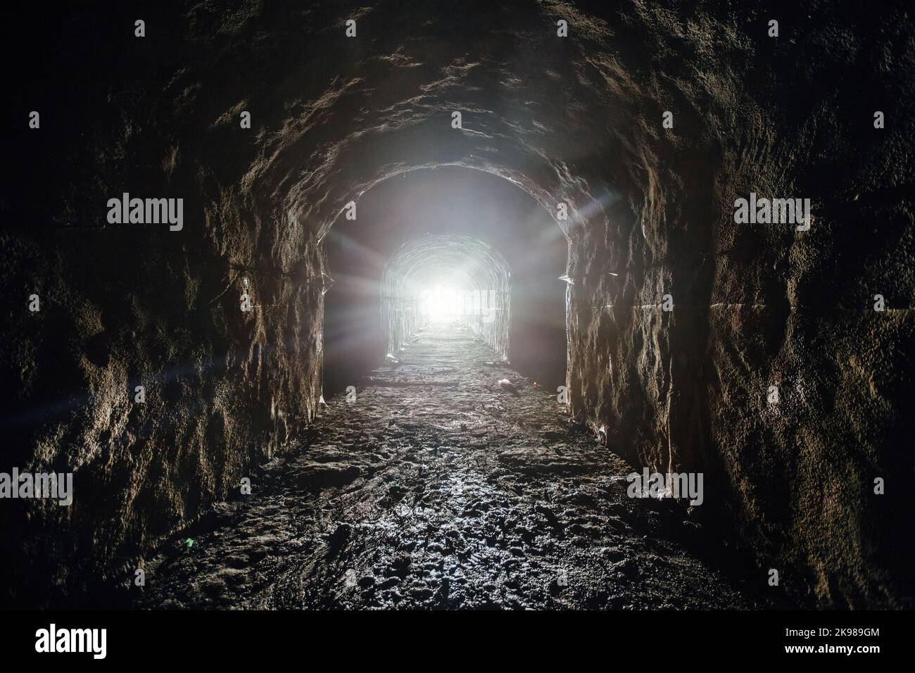Dark underground tunnel. Light at the end of tunnel Stock Photo - Alamy