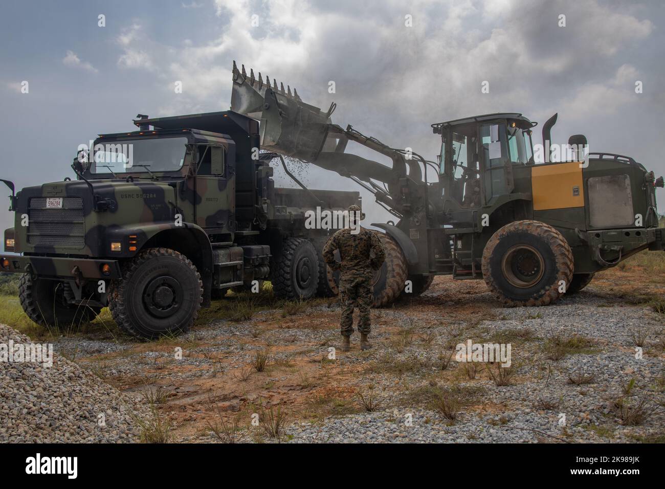 A U.S. Marine with Marine Wing Support Squadron (MWSS) 172 observes ...
