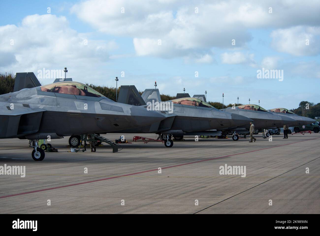 Four U.S. Air Force F-22 Raptors assigned to the 90th Expeditionary ...