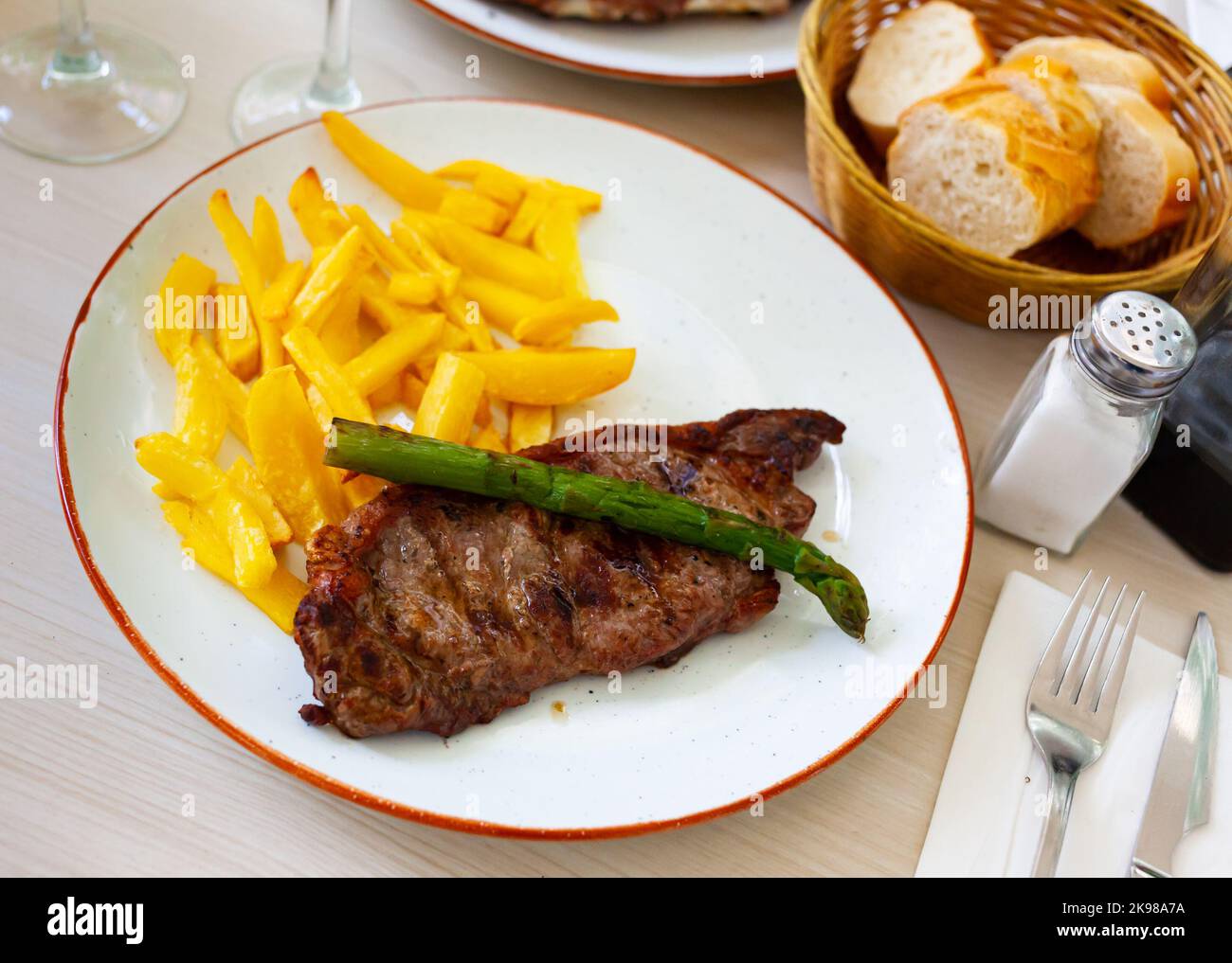 Roasted beef loin with asparagus and fried potato Stock Photo - Alamy