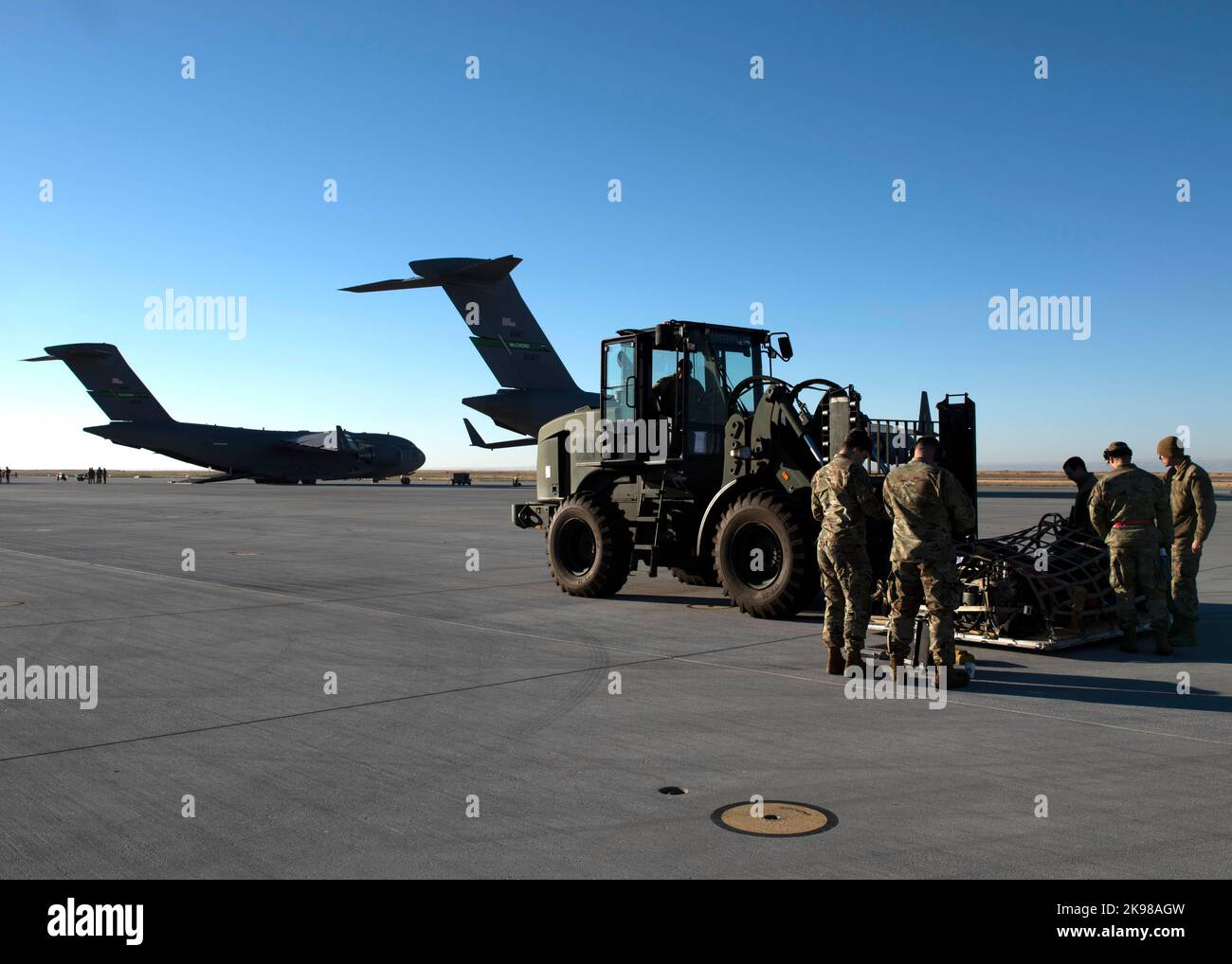 U.S. Airmen with the 62d Maintenance group prepare a cargo pallet to be ...