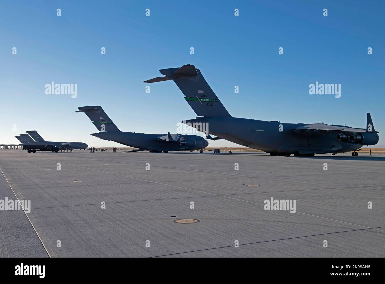 A row of C-17 Globemaster III aircraft from the 62d Airlift Wing rest ...