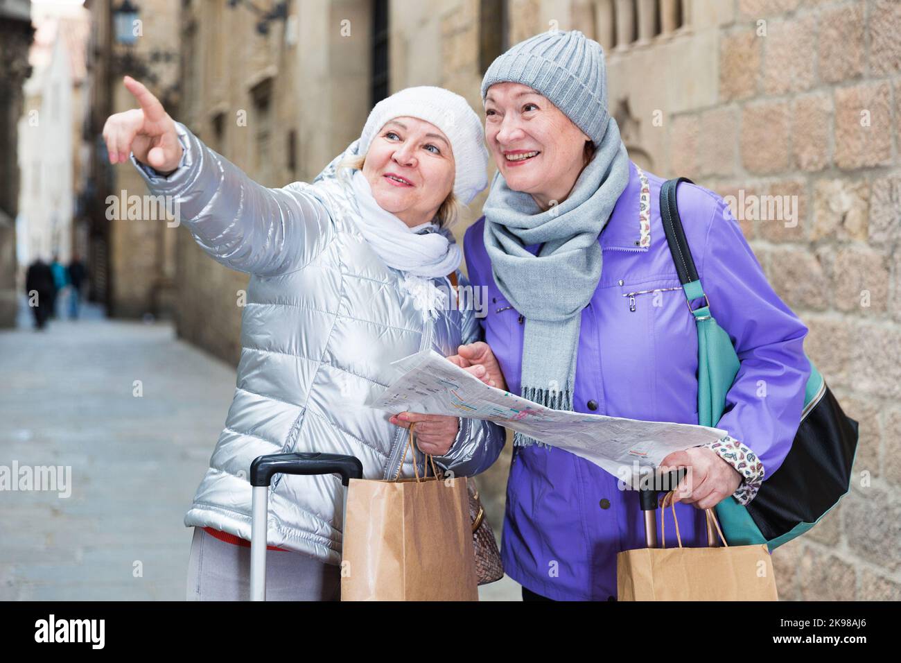 Elderly women tourists with city guide Stock Photo - Alamy