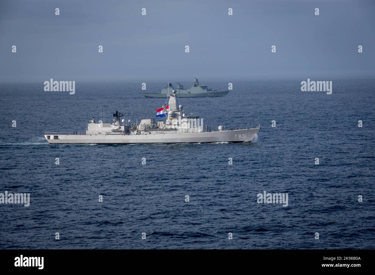 The Dutch frigate HNLMS Van Amstel (F 831) steams in formation with the ...