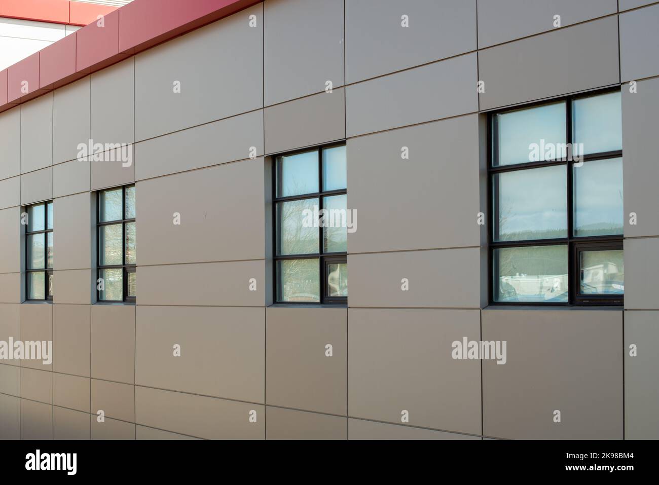 The exterior wall of a contemporary commercial style building with ...