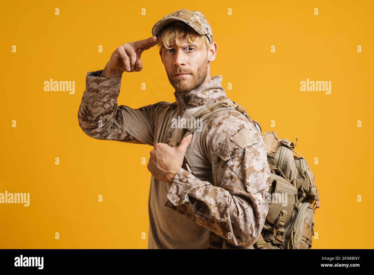 White military man wearing uniform looking at camera and saluting ...