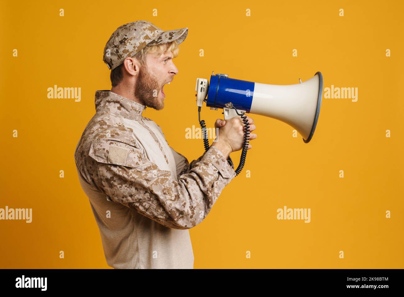 European military man wearing uniform shouting in megaphone isolated ...