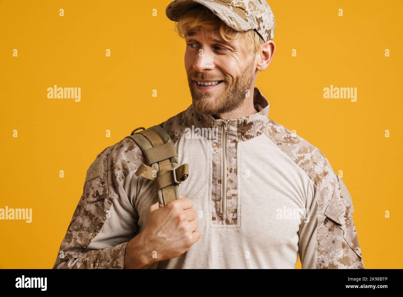 White military man wearing uniform smiling and looking aside isolated ...