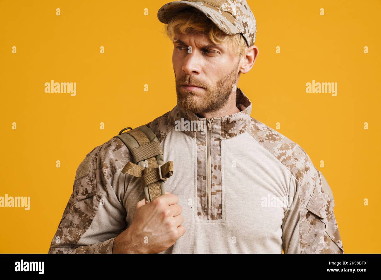 White military man wearing uniform posing and looking aside isolated ...
