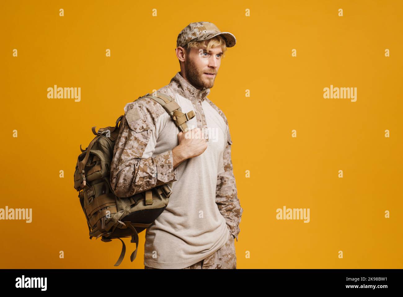 White military man wearing uniform posing and looking aside isolated ...