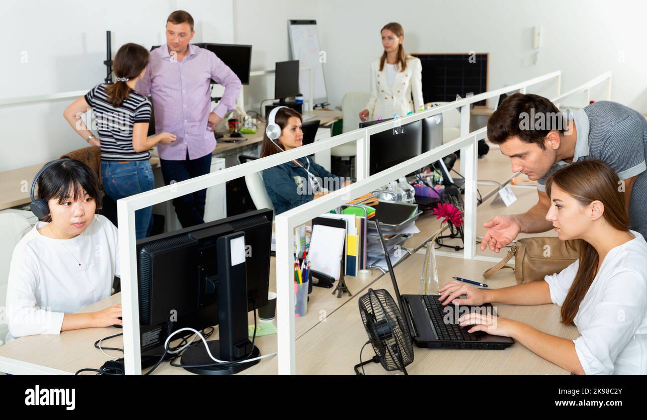International business team working and communicating together in ...