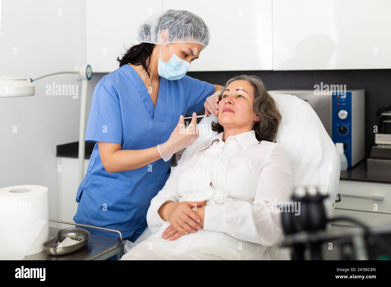 Mature woman getting ready for plastic surgery closeup Stock Photo - Alamy