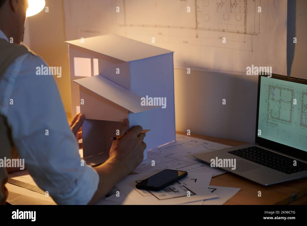 Architect making model of house out of paper Stock Photo - Alamy