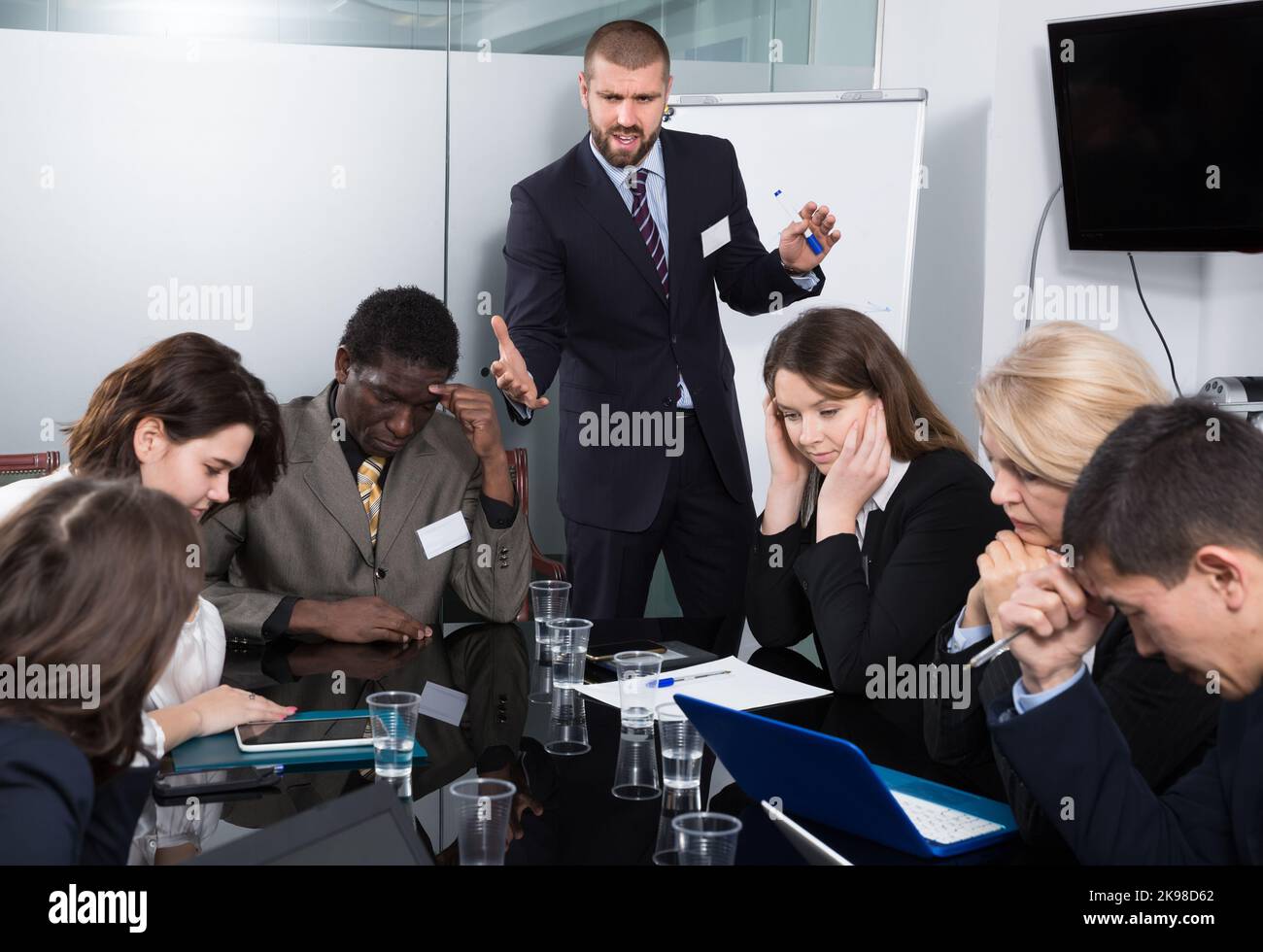Angry boss berating his managers pointing out shortcomings Stock Photo ...